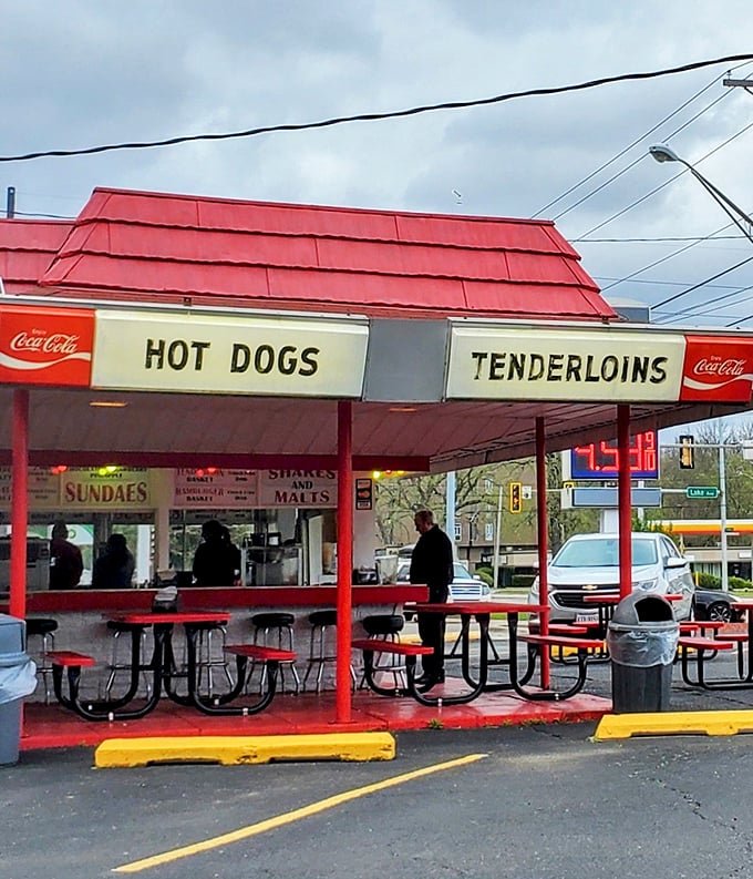 The covered counter area offers shelter from sun and rain, but nothing can dampen the spirits of those waiting for Lou's legendary tenderloins.