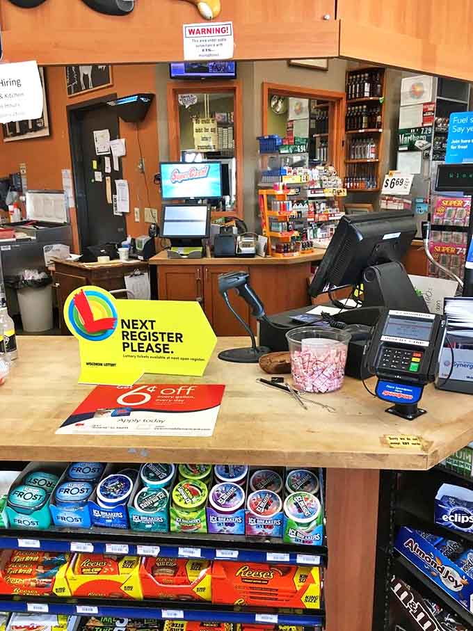 The full bakery experience: display cases filled with temptation, bread racks stocked, and customers contemplating their sweet dilemmas.