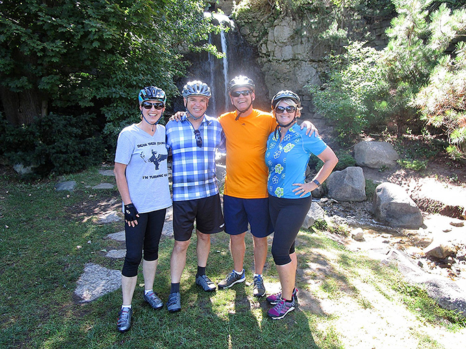 These cyclists have discovered the secret to happiness &ndash; friends, fresh air, and a waterfall backdrop that makes selfies practically take themselves.