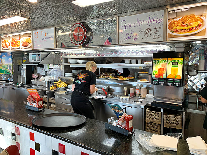 Behind the scenes magic happens here, where short-order cooks perform their breakfast ballet with decades of muscle memory.
