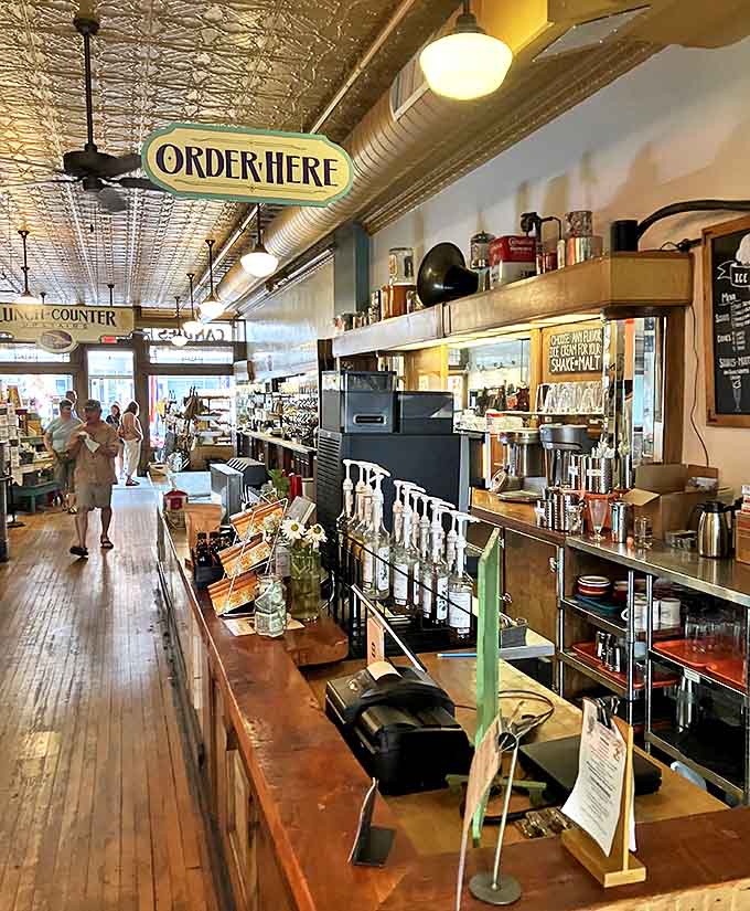 The counter where magic happens, transforming simple ingredients into sundaes and sandwiches that justify the drive to Marquette all by themselves.