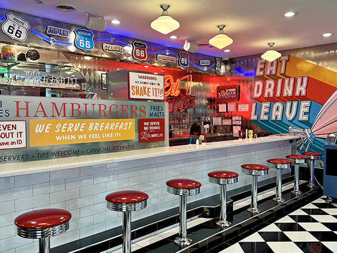 That classic diner counter with chrome stools practically begs you to spin around while sipping a milkshake like it's 1957.