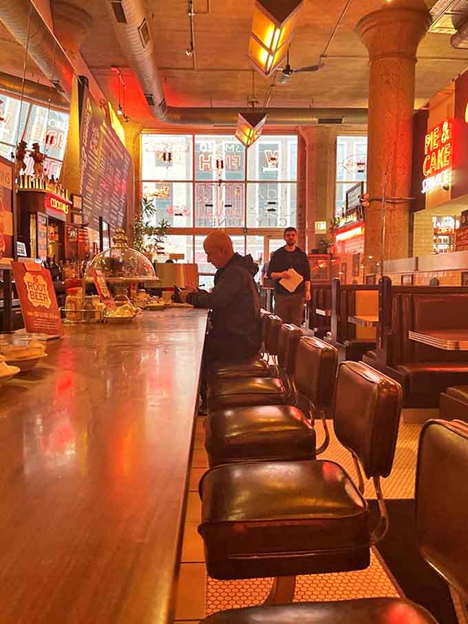 The counter beckons with its row of classic stools &ndash; each one a front-row seat to the choreographed ballet of diner service.