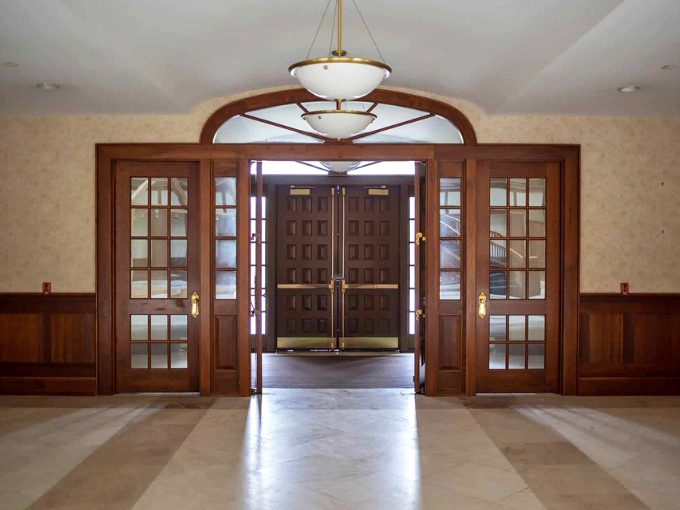 These doors could lead to Narnia, but instead open to the most unique office space in America. Elegant wood detailing continues the basket motif.