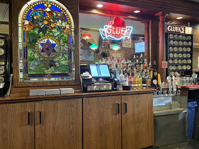 Bar area: Belly up to history at this gleaming wooden bar, where stained glass windows filter light onto perfectly poured pints.