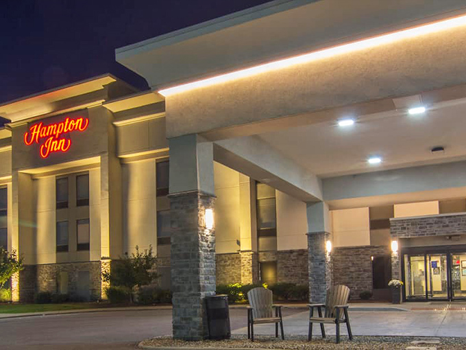 Hampton Inn's welcoming entrance glows warmly at dusk, beckoning weary travelers with the promise of comfortable beds after a day of Medina exploration.