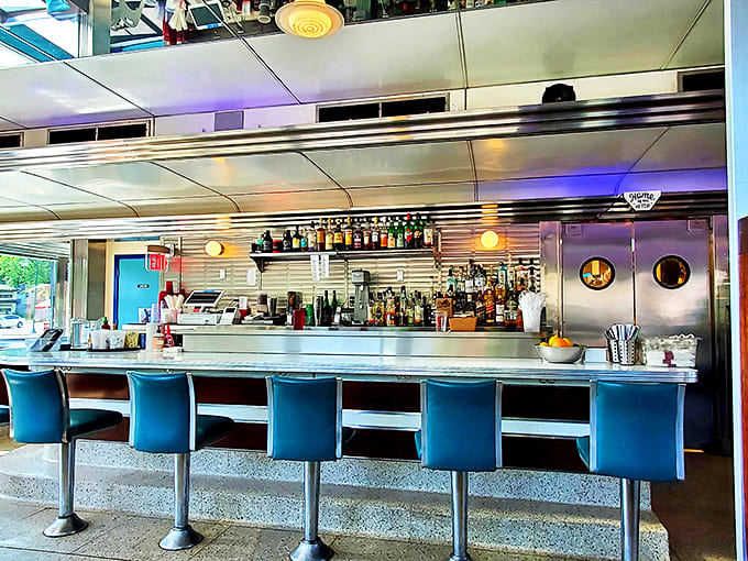 The counter seating offers front-row tickets to the culinary show, where coffee flows freely and breakfast dreams come true.