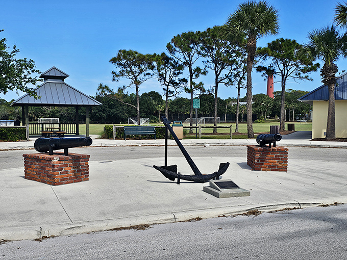 Maritime artifacts stand sentinel at the lighthouse grounds, iron giants resting after lifetimes of holding ships steady.