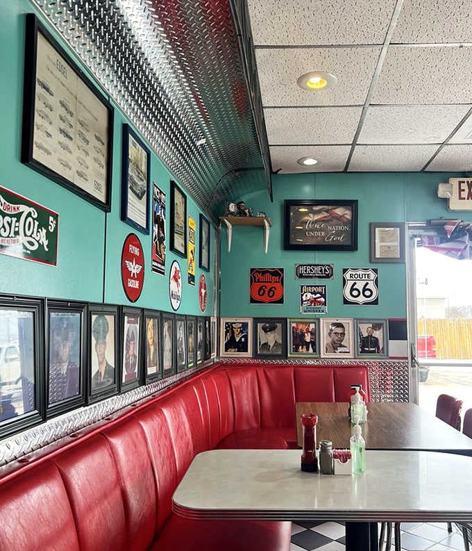 The turquoise walls adorned with vintage memorabilia create the perfect backdrop for conversations that span generations.