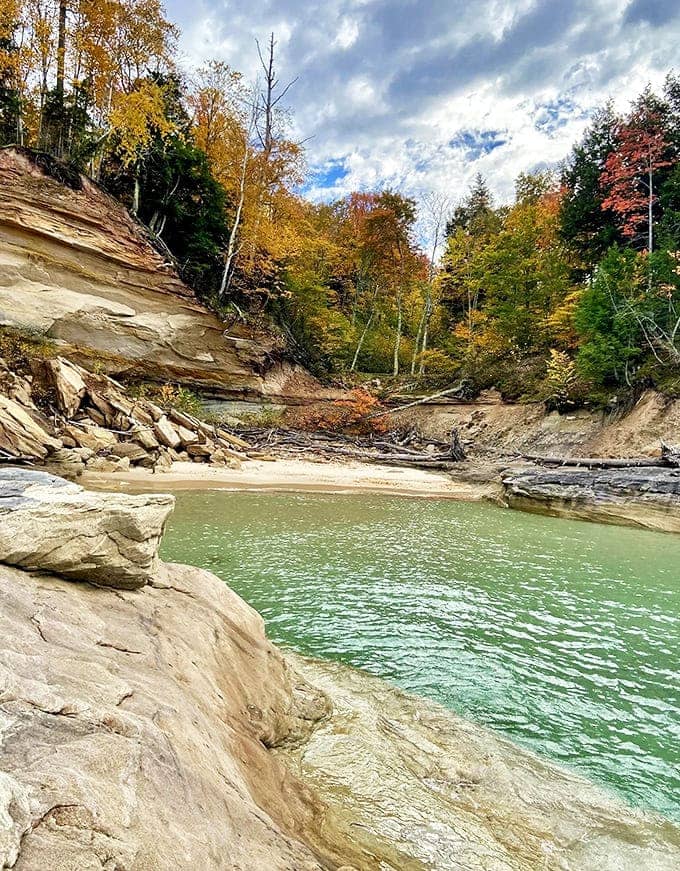 The emerald-turquoise waters of Lake Superior reveal incredible clarity near the shoreline, a startling contrast to the lake's reputation for frigid depths.