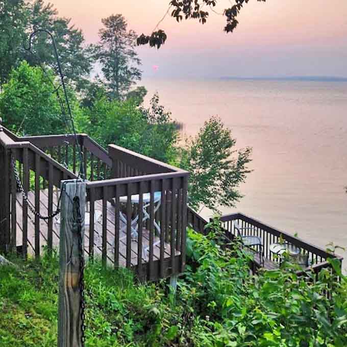 Wooden steps cascade down to the lake, each one bringing you closer to the kind of tranquility money usually can't buy.