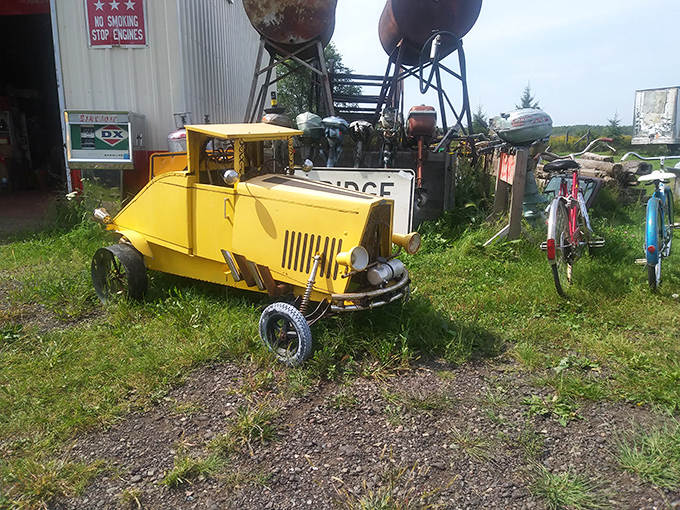 This yellow pedal car doesn't just sit there, it practically begs for one more childhood adventure across imaginary highways of yesteryear.