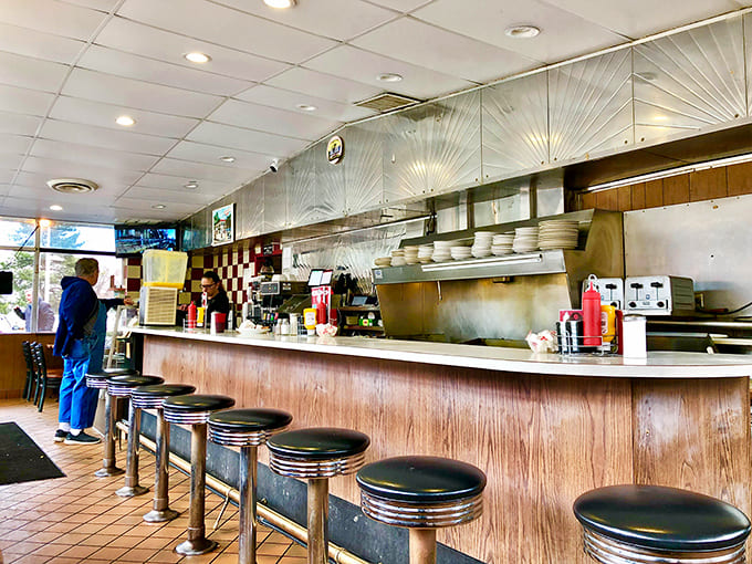 The heart of operations &ndash; where orders are called, coffee is poured, and the rhythm of diner life plays out in a well-choreographed dance.