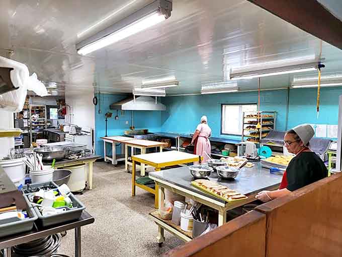 In the kitchen, traditional methods reign supreme as bakers work with practiced hands, creating magic without modern shortcuts.