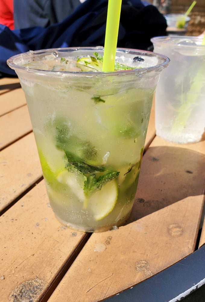 The classic mojito&mdash;where mint leaves aren't just garnish but tiny flags signaling surrender to island time and Ohio relaxation.