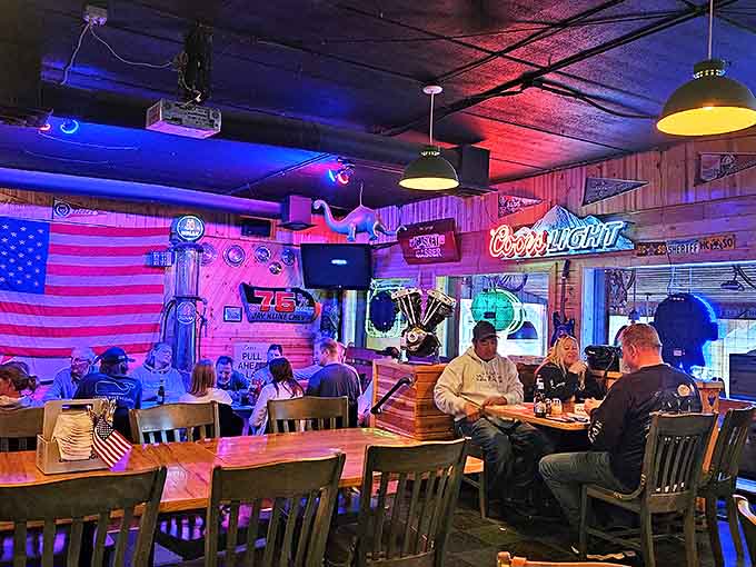 The dining room hums with conversation and laughter, creating that perfect small-town tavern vibe where everyone feels like a regular.