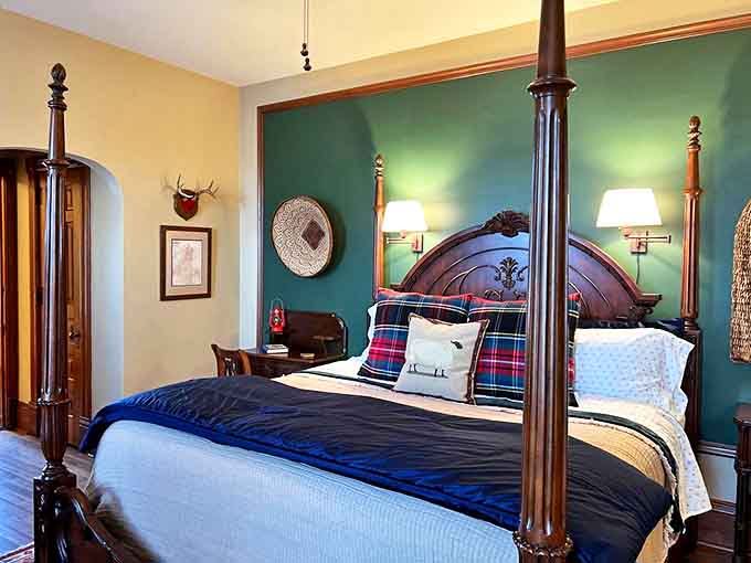 Wrapped in rich green walls and anchored by a majestic four-poster bed, this room makes you feel like Minnesota royalty on vacation.