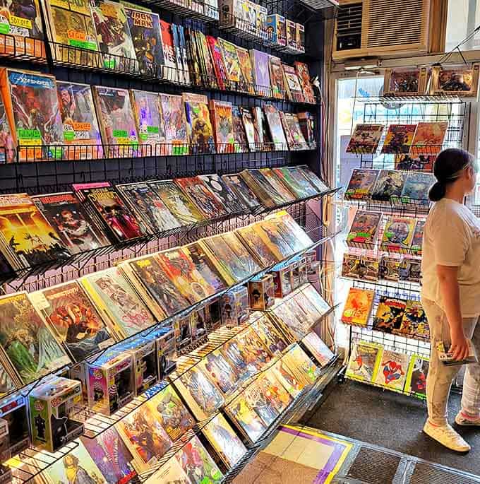Numerous comic books: A wall of worlds waiting to be explored &ndash; each spine a doorway to adventure that fits conveniently in your back pocket.