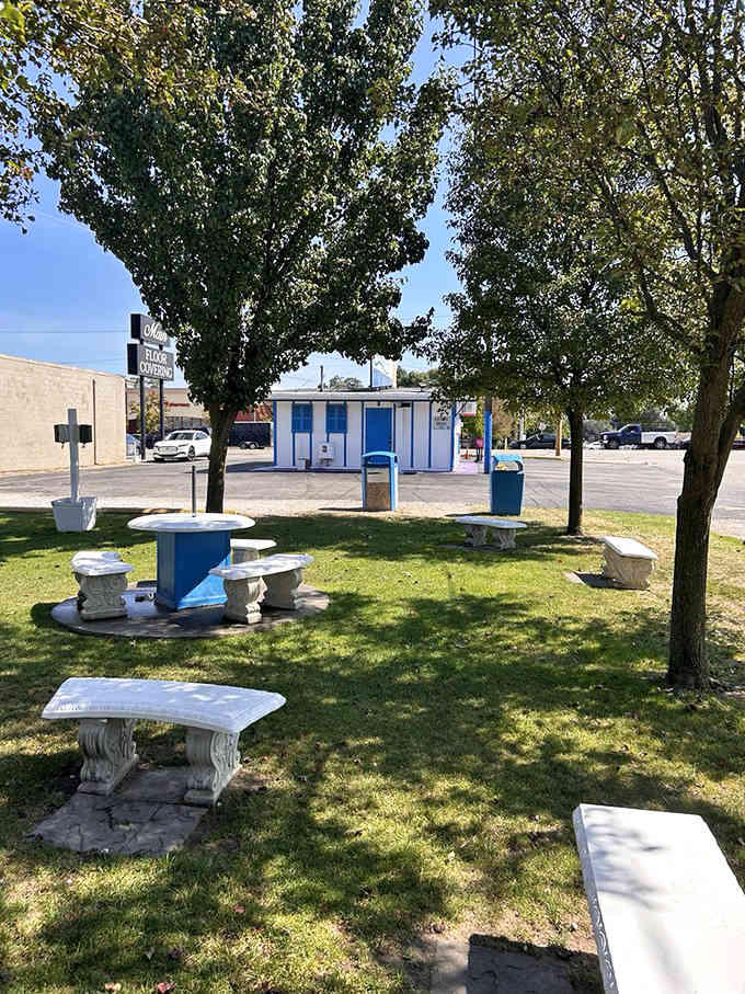 Stone benches under shady trees create the perfect setting for savoring your frozen masterpiece on a summer afternoon.