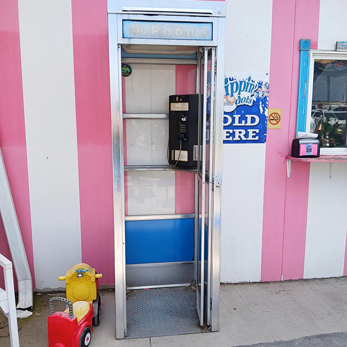 Communication from another era: A vintage phone booth stands ready, perhaps for Clark Kent or time travelers needing to call home.