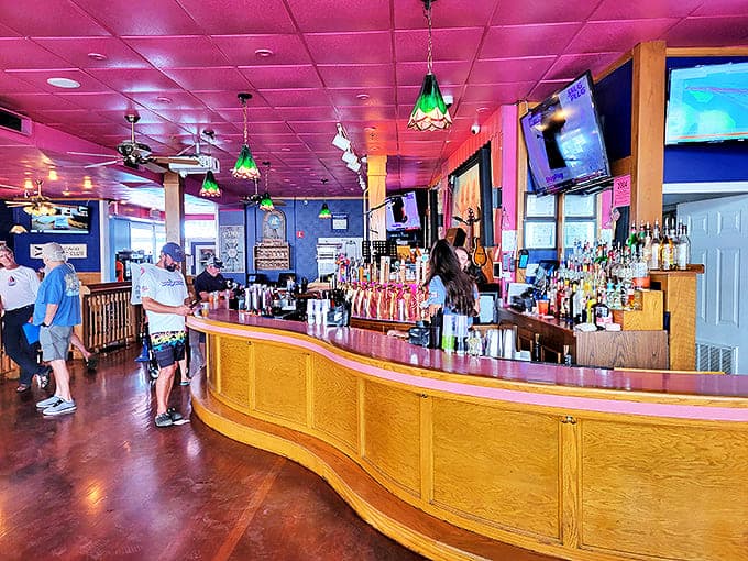 The curved wooden bar invites you to pull up a stool and sample Michigan craft beers while swapping island adventure stories.