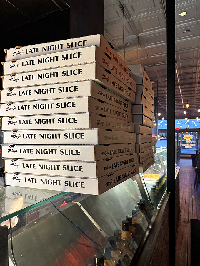 Pizza boxes stacked like treasure chests waiting to be claimed &ndash; each cardboard container holds the promise of delicious salvation for lucky Columbus residents.