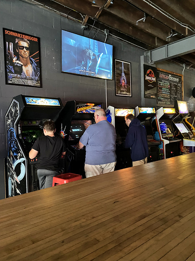 Where generations connect through joysticks and buttons &ndash; seasoned gamers showing newcomers the ropes of classic arcade action.