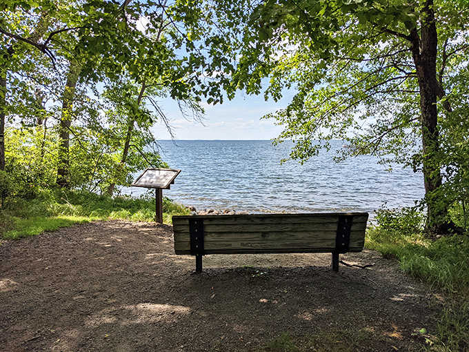 Sometimes the best vacation activity is simply sitting still, as this lakeside bench quietly suggests to hurried visitors.