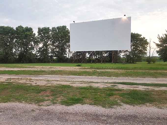 The Route 66 Drive-In sign stands tall, a colorful beacon calling movie lovers to experience cinema the way previous generations did.