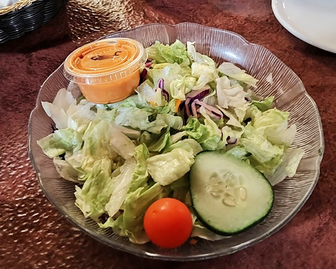 A simple garden salad that knows its role &ndash; crisp, fresh, and ready to prepare your palate for the feast that follows.