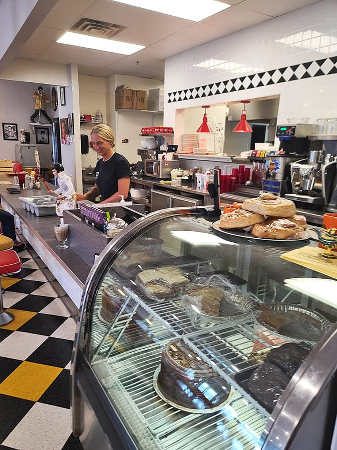 The service counter gleams with promise, showcasing freshly baked goods that whisper sweet temptations to willpower-challenged customers.