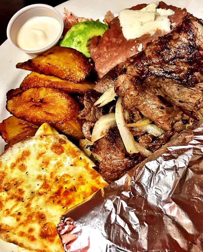 This isn't just steak &ndash; it's a carnivore's dream vacation, accompanied by fried plantains that blur the line between side dish and dessert.