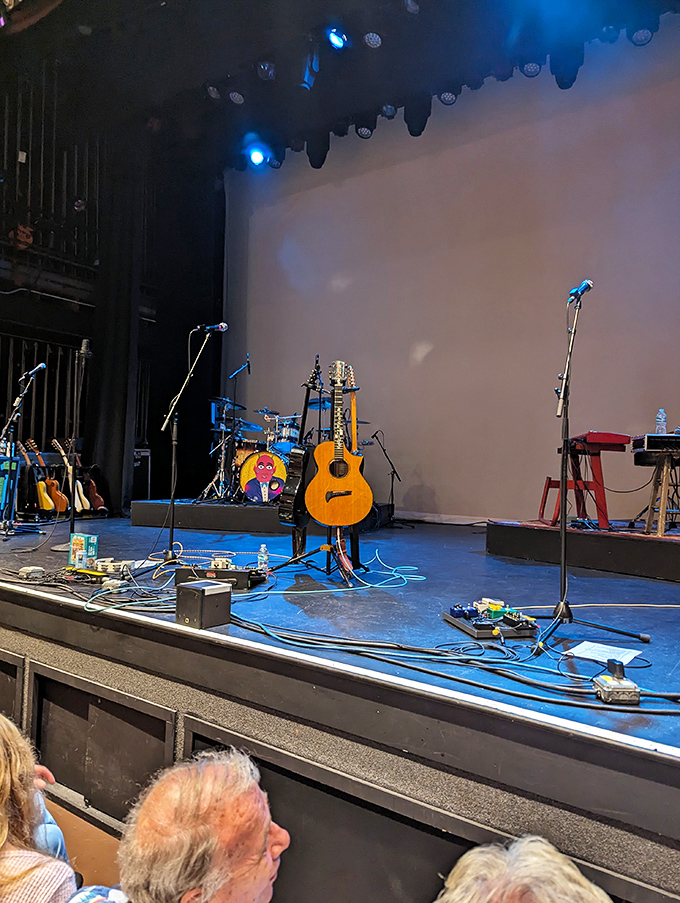 Musicians' instruments wait in the spotlight, promising an evening of sonic magic in a space where every note reaches every ear.