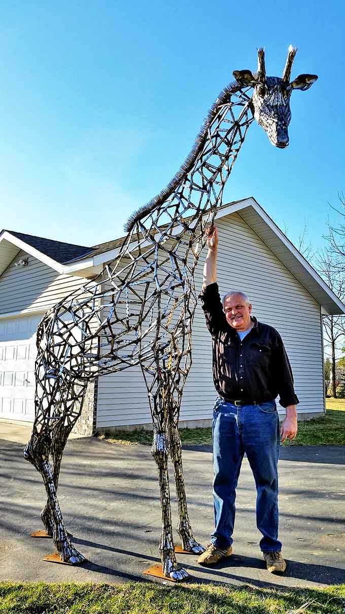 Reaching skyward with elegant lines, this giraffe sculpture shows how negative space can be just as important as the metal itself.