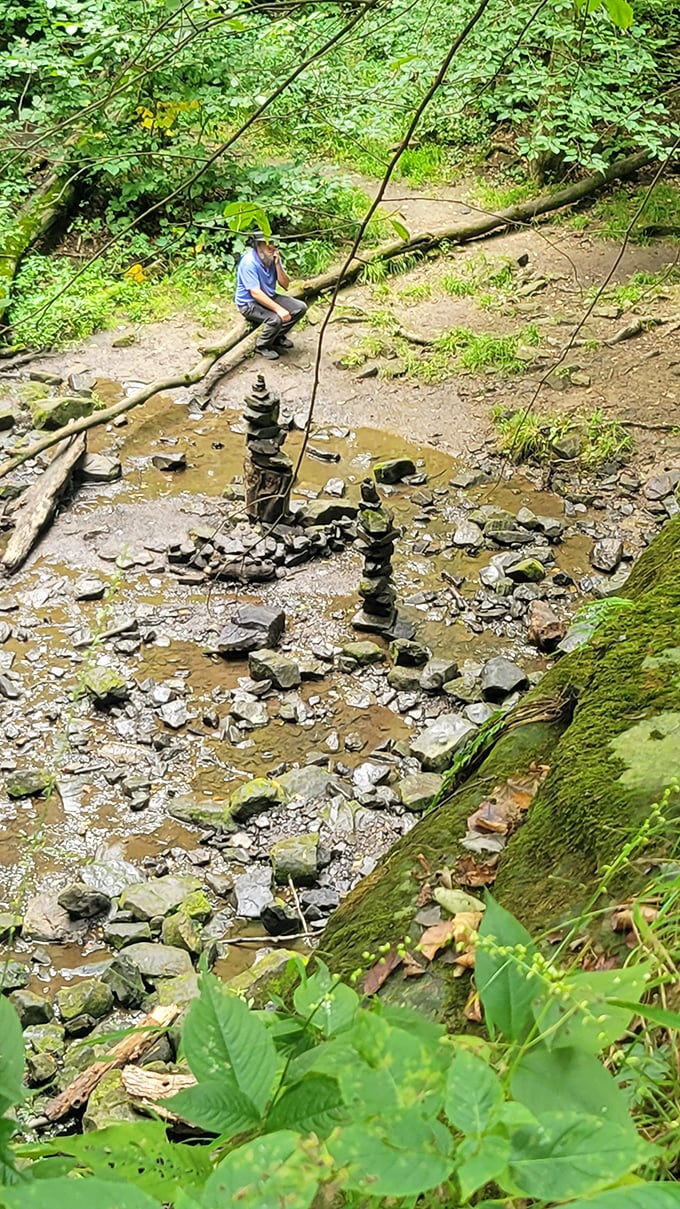 Stone towers rise from the creek bed like miniature monuments, each balanced rock a testament to human patience and nature's possibilities.