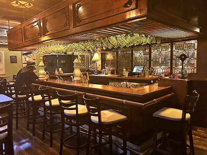 The bar gleams with promise&mdash;steins hanging overhead like trophies, stained glass catching light, and taps ready to pour liquid gold into waiting glasses.