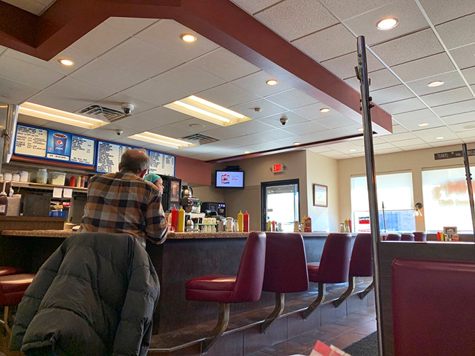 The bar area serves as Mihm's social hub, where regulars and newcomers alike gather to worship at the altar of charcoal-grilled perfection.