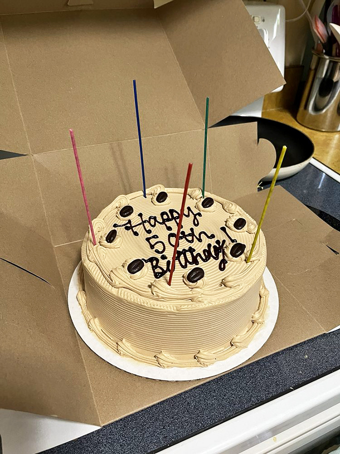 Happy Birthday spelled out in chocolate atop a mocha cake &ndash; simple, classic, and guaranteed to make someone's special day even sweeter.