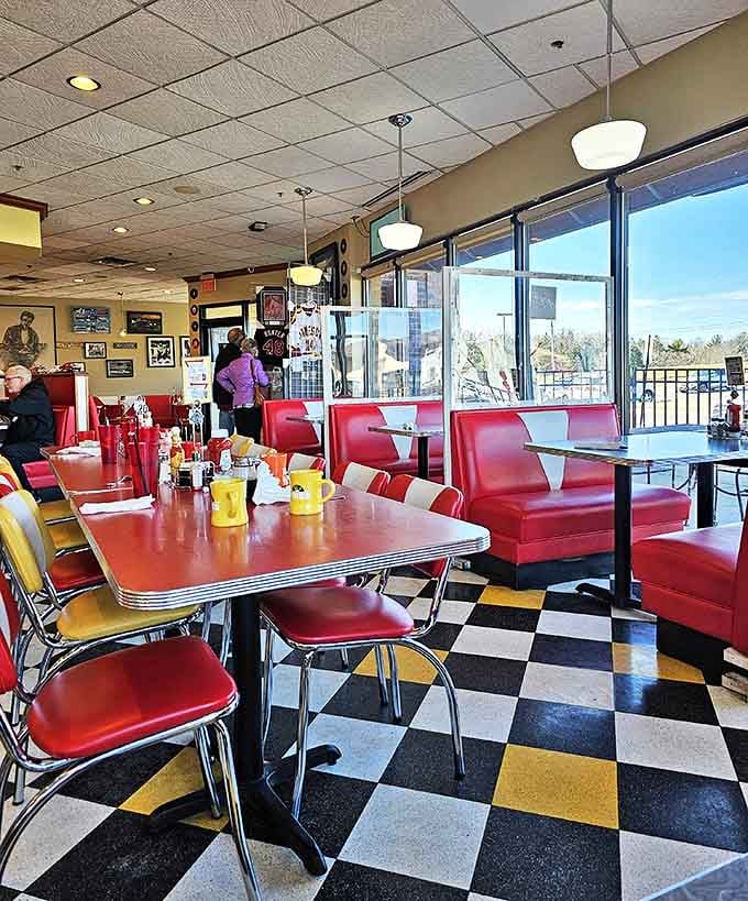 Cherry-red booths invite you to slide in and get comfortable &ndash; these aren't seats, they're time machines to a more colorful era.