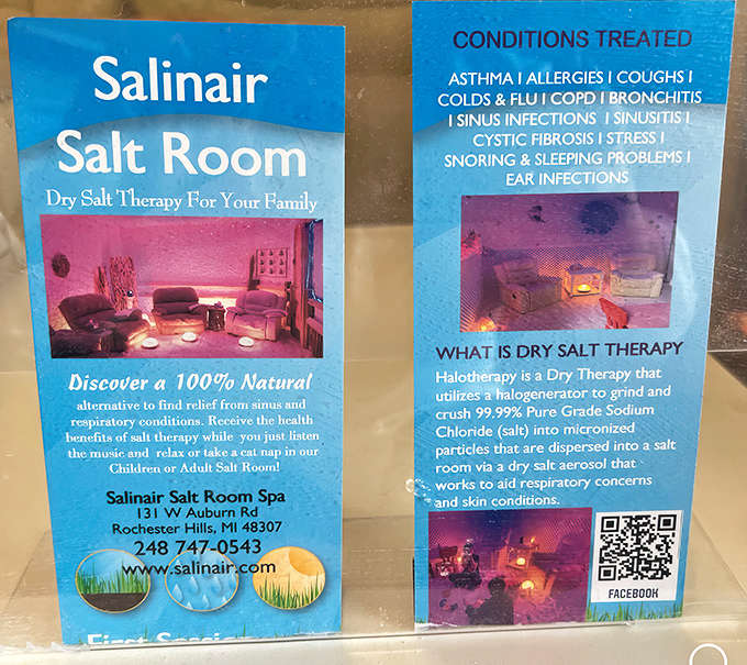 Educational materials and essential oils demonstrate Salinair's commitment to holistic wellness beyond just the salt therapy sessions.
