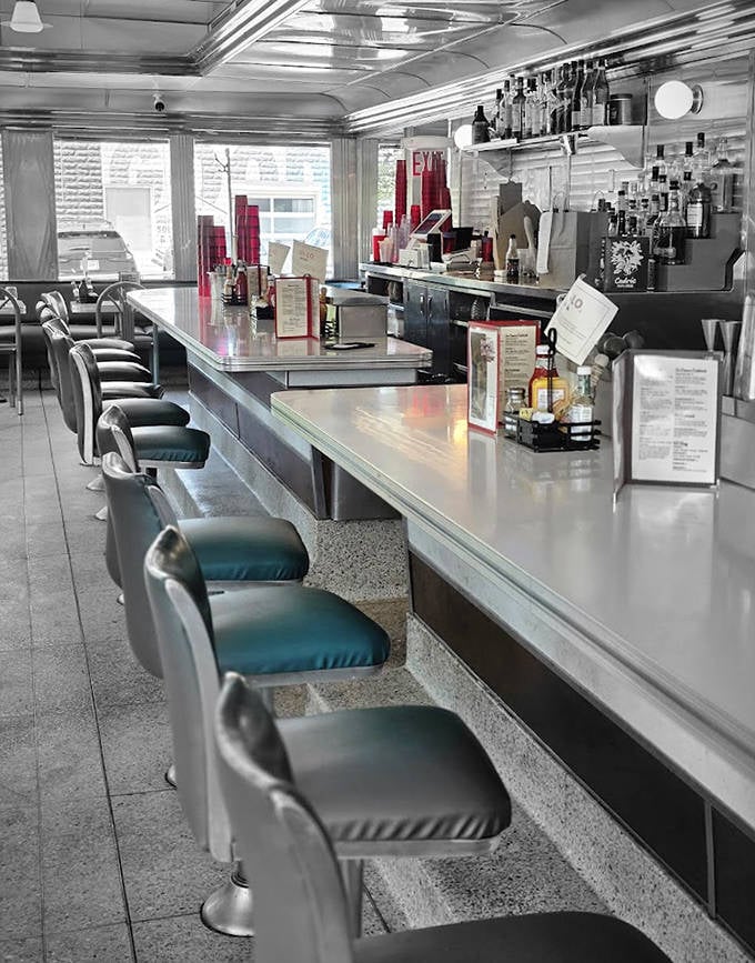 Where solo diners become temporary family, watching the ballet of short-order cooking while nursing coffee in sturdy mugs that mean business.