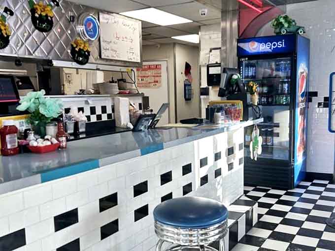 Where culinary magic happens in full view, with swivel stools that make everyone feel like they're in an Edward Hopper painting come to life.