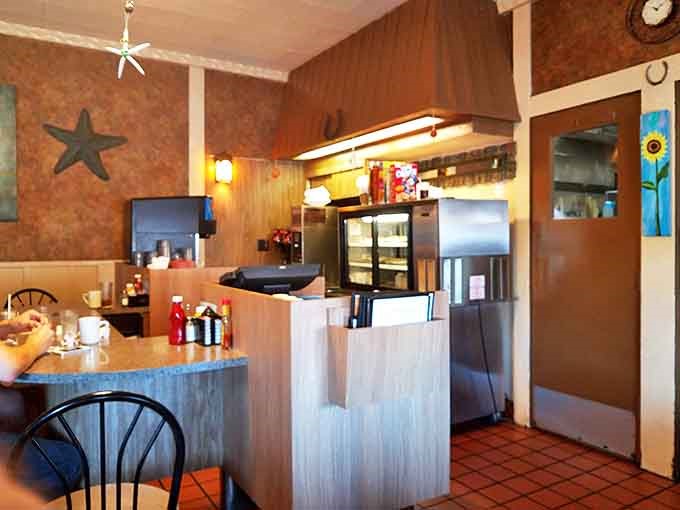 The heart of operations &ndash; where orders are taken, coffee is poured, and the rhythm of diner life is orchestrated with practiced precision.