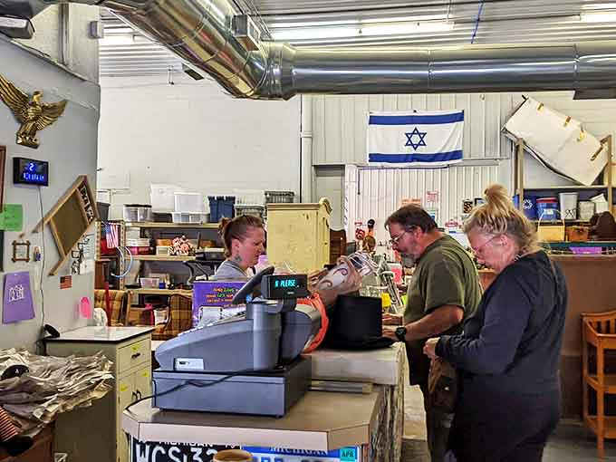 Pink walls and vintage pendant lights create the perfect backdrop for the daily ritual of community connection that happens across this well-loved counter.