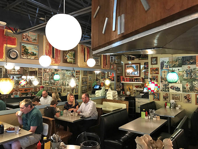 Diners enjoy their morning feast surrounded by an eclectic gallery of vintage paintings, proving good conversation and good food are art forms themselves.