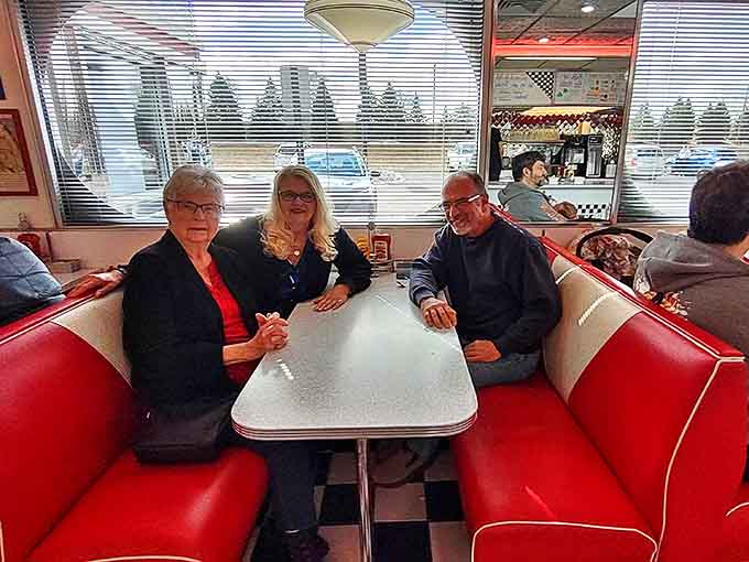 Conversations flow across tables as diners settle into comfortable booths, creating connections that are as nourishing as the food.