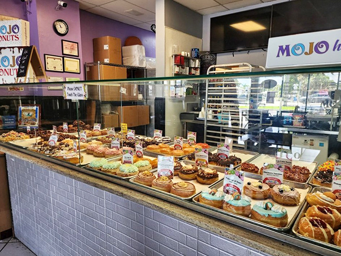 The display case stretches like a horizon of possibilities &ndash; each donut a different destination in a world where calories don't count.