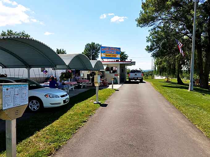 The entrance sign points the way to drive-in heaven &ndash; where ordering through a speaker still feels like a special kind of magic.