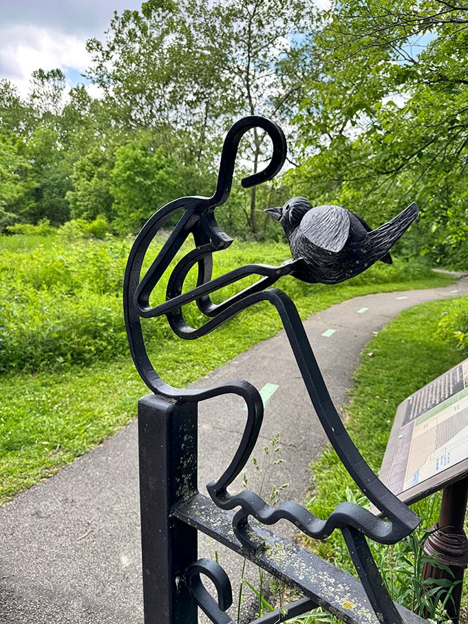 This whimsical gate design featuring a bird welcomes visitors to the trail system, setting the tone for discovery.