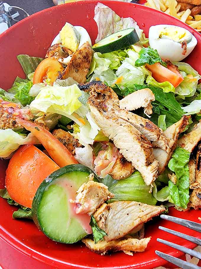 Proof that "healthy option" doesn't mean punishment&mdash;this vibrant bowl brings together crisp vegetables and seasoned chicken in perfect harmony.